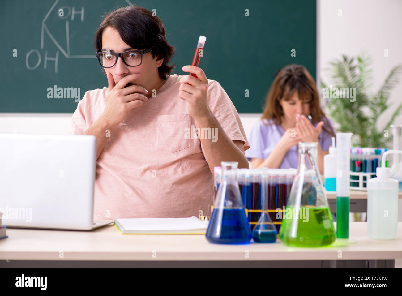 Two chemists students in classroom Stock Photo - Alamy
