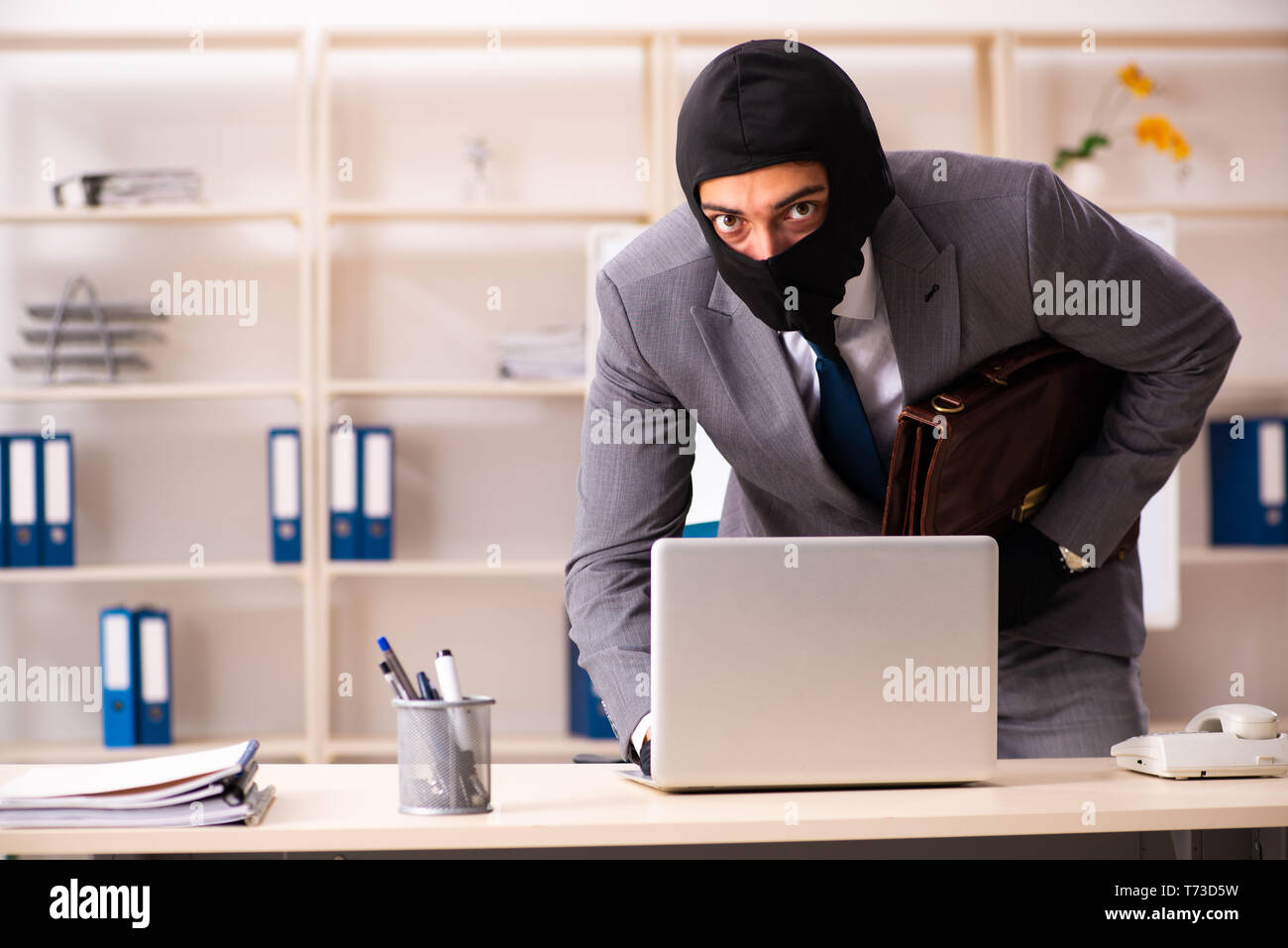 Office stealing hi-res stock photography and images - Alamy