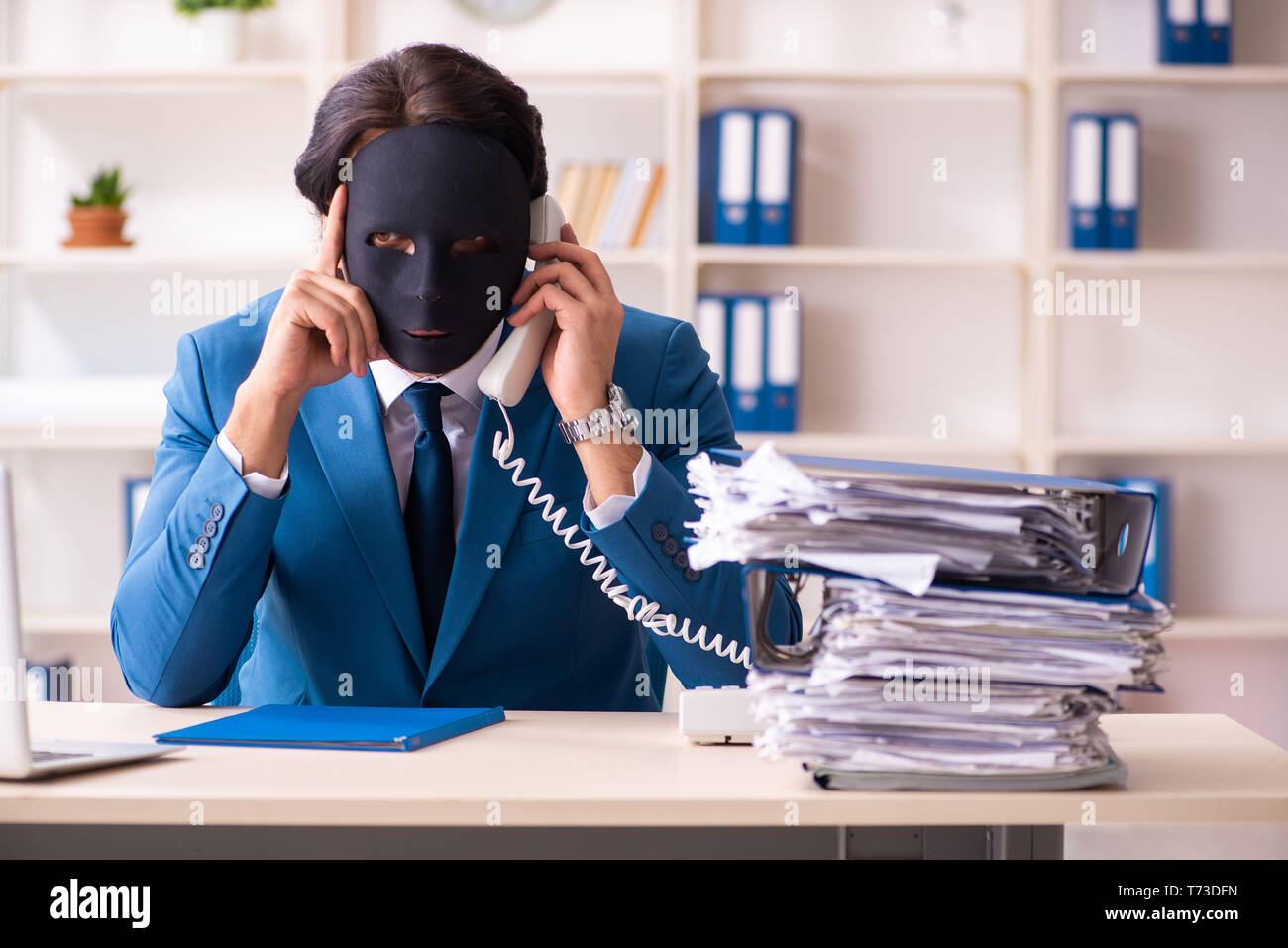 Male employee in the office in industrial espionage concept Stock Photo ...