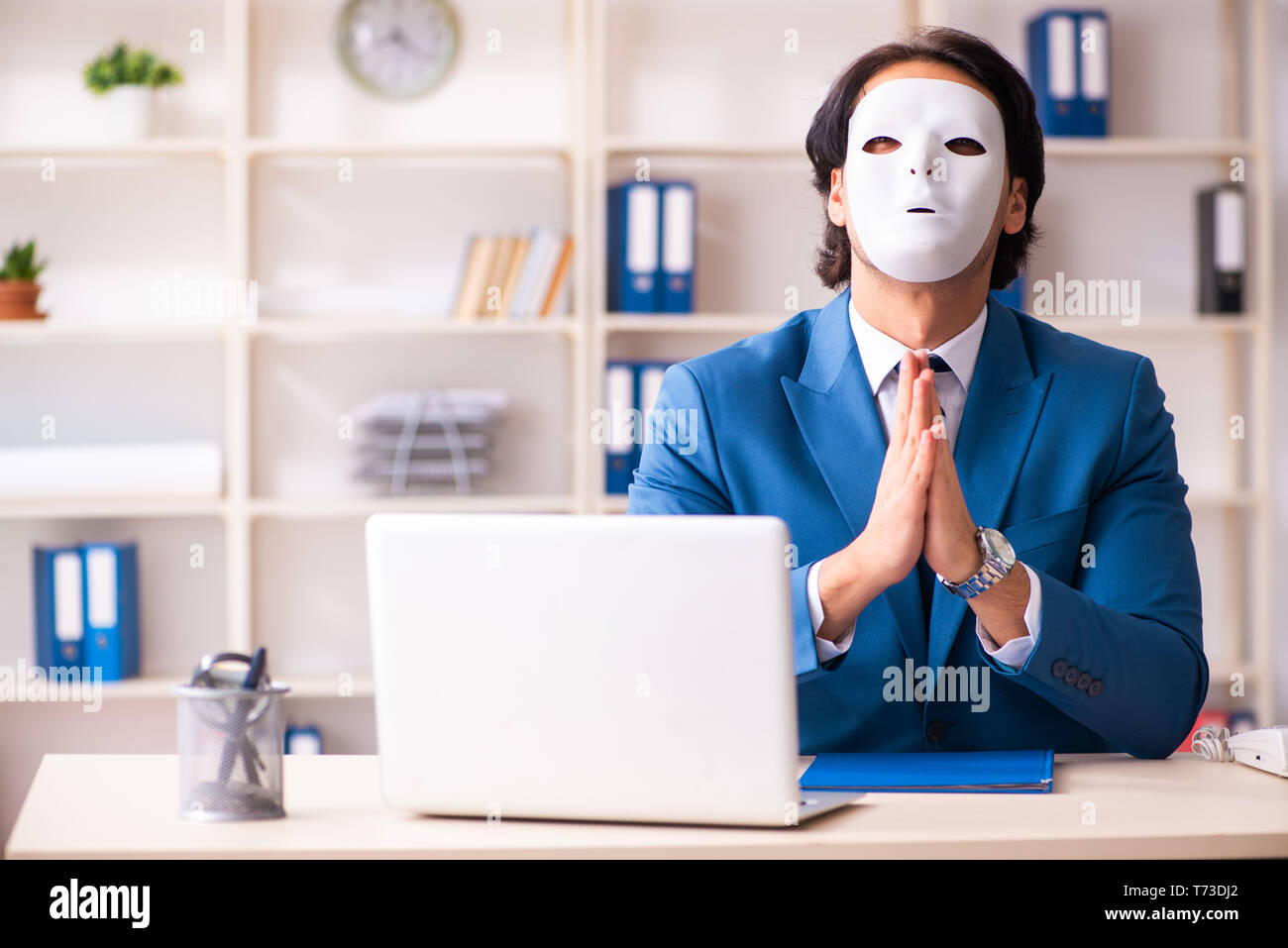 Male employee in the office in industrial espionage concept Stock Photo ...
