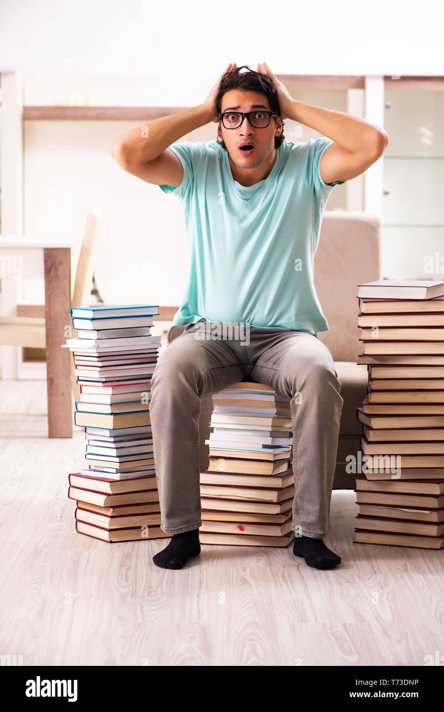 Frustrated boy with stack of books hi-res stock photography and images ...