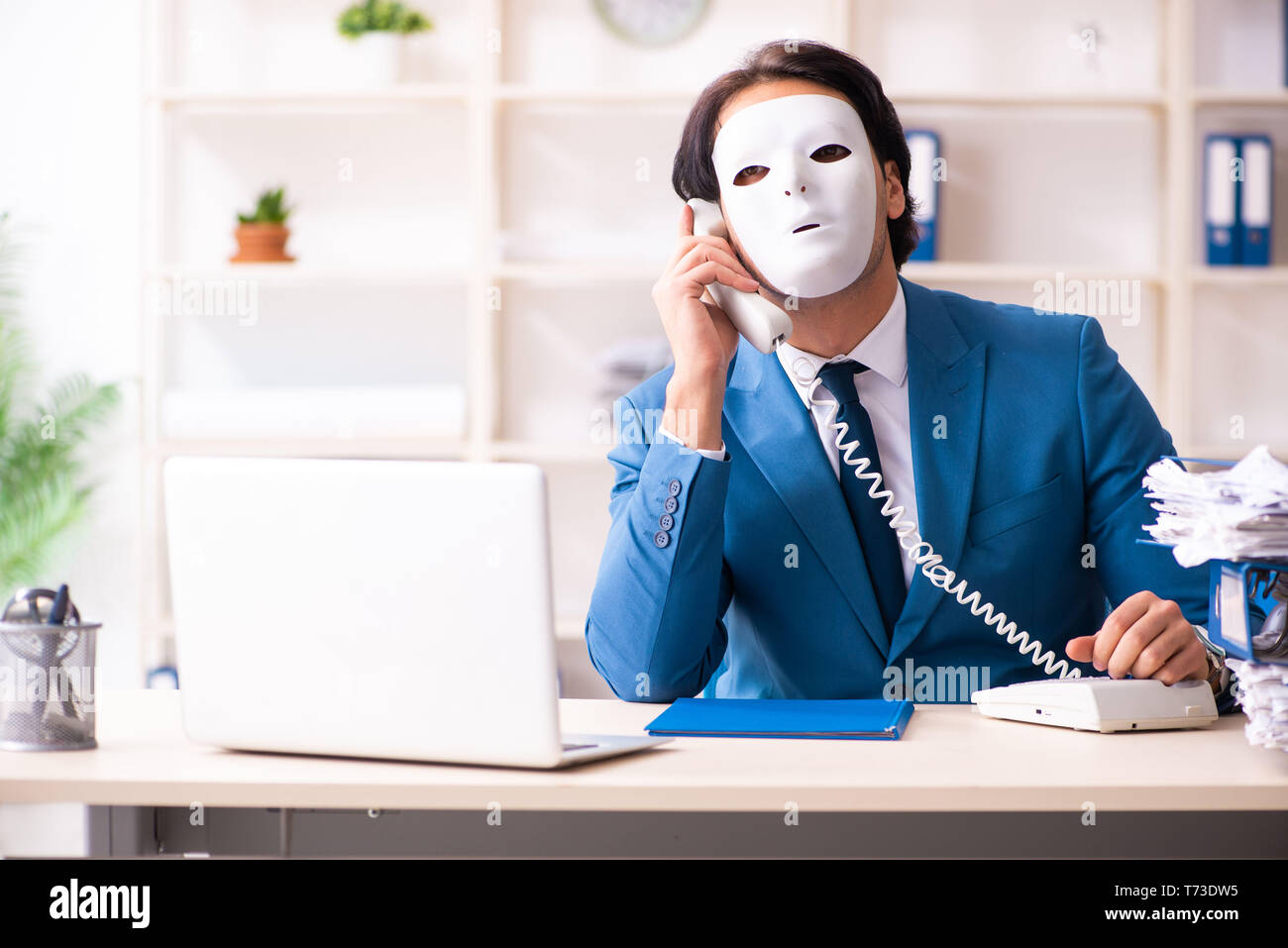 Male employee in the office in industrial espionage concept Stock Photo ...