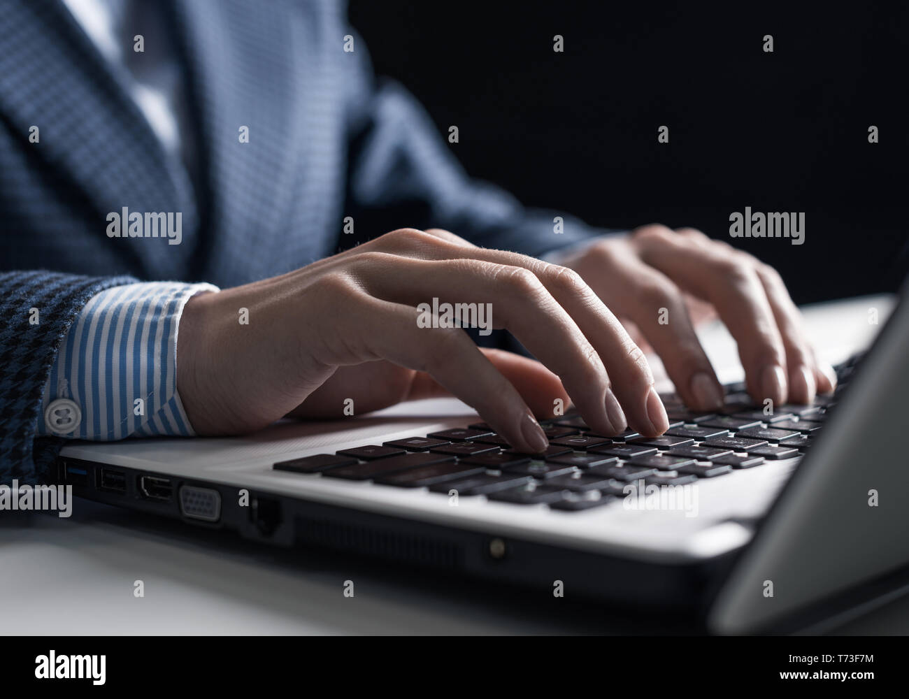 Man in business suit sitting at desk Stock Photo - Alamy