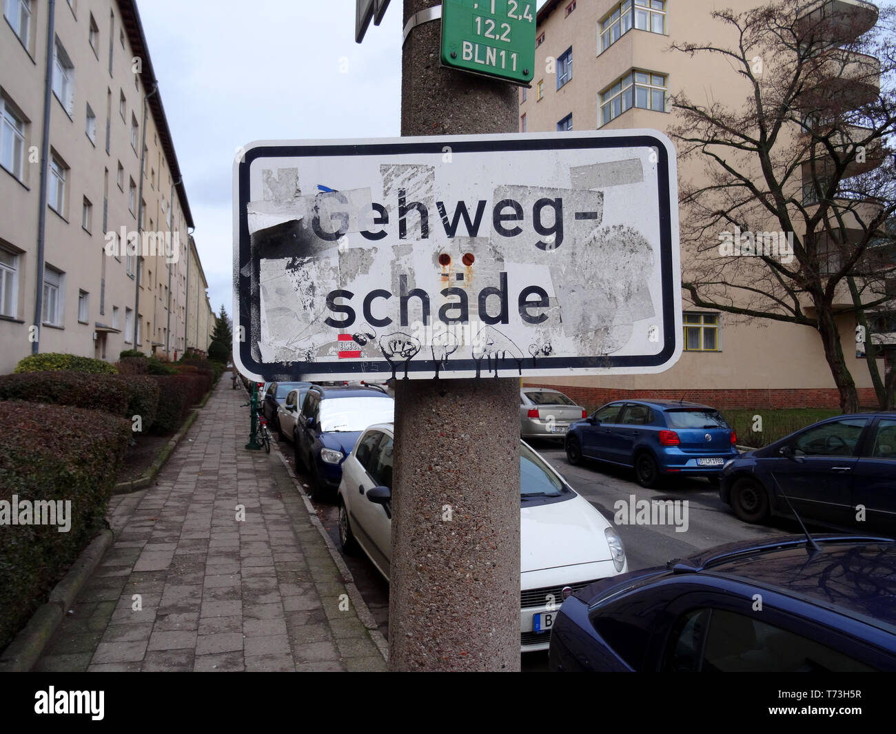 Street sign in front of buildings. Attention for road users because of ...