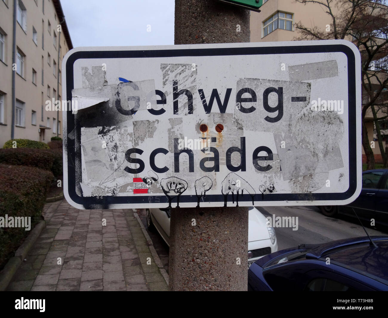 Street sign in front of buildings. Attention for road users because of ...