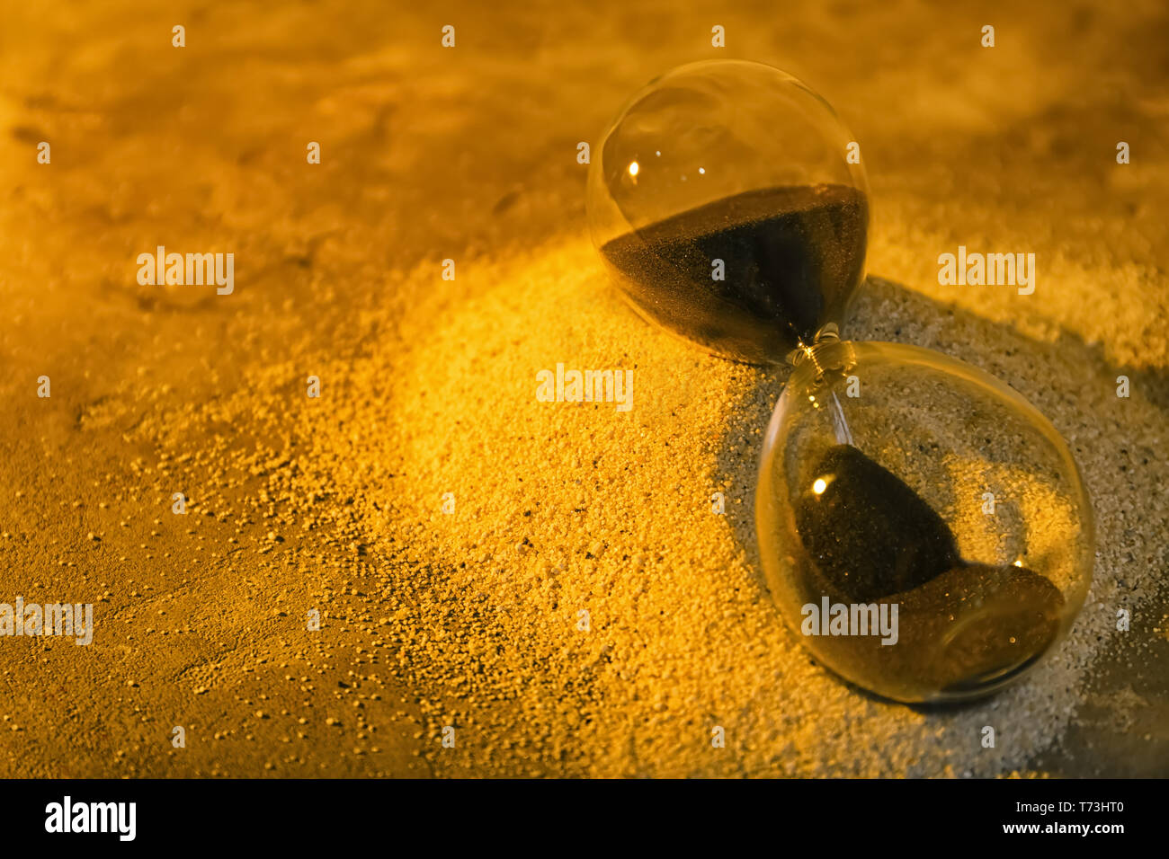 Hourglass on sand. Time management concept Stock Photo - Alamy