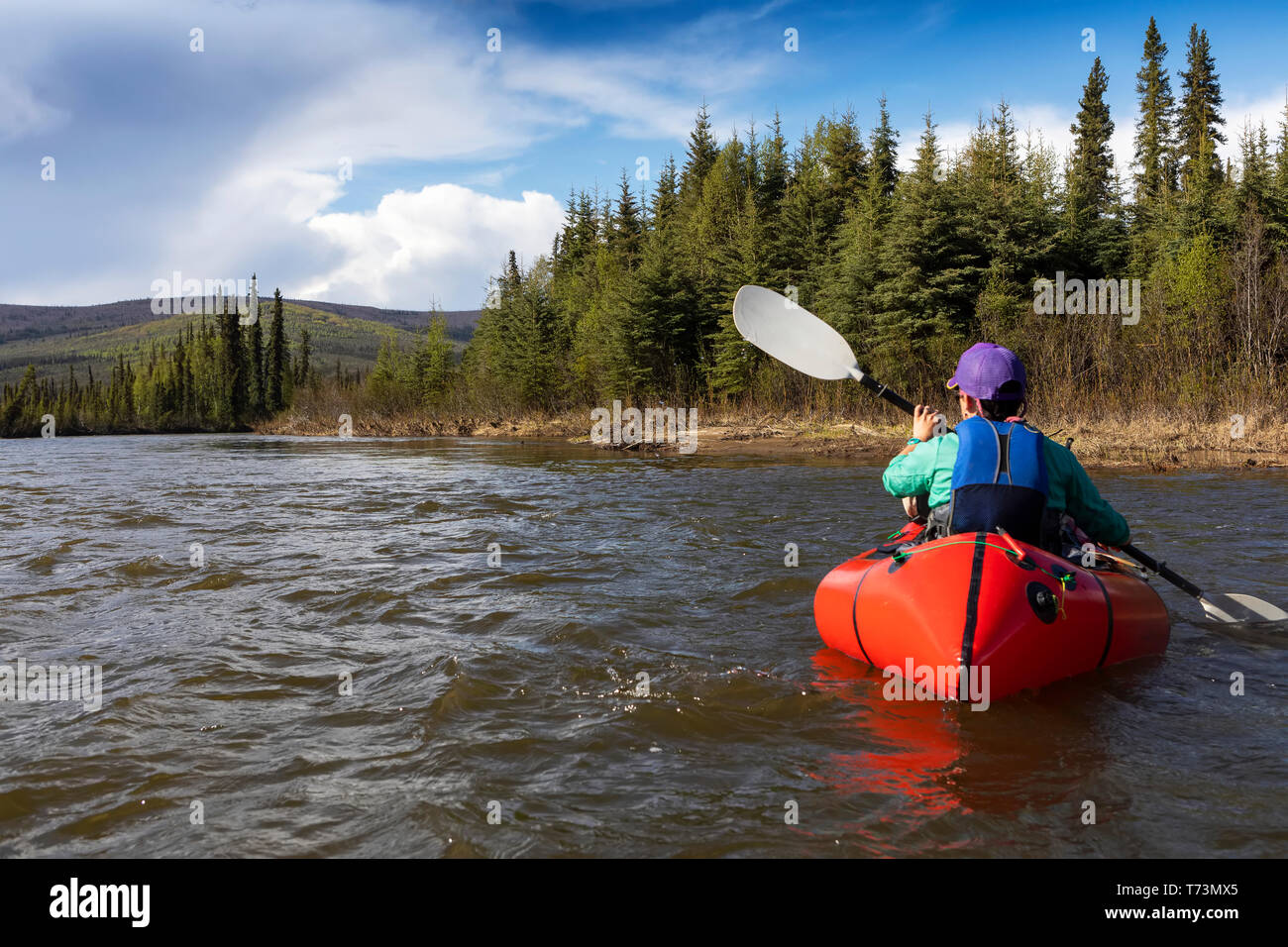 Woman packrafting down Beaver Creek, National Wild and Scenic Rivers ...