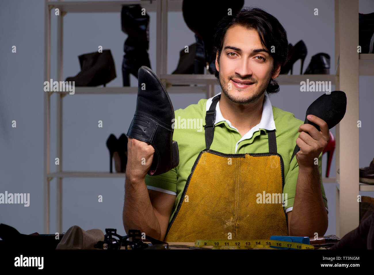 Smiling shoemaker hi-res stock photography and images - Alamy