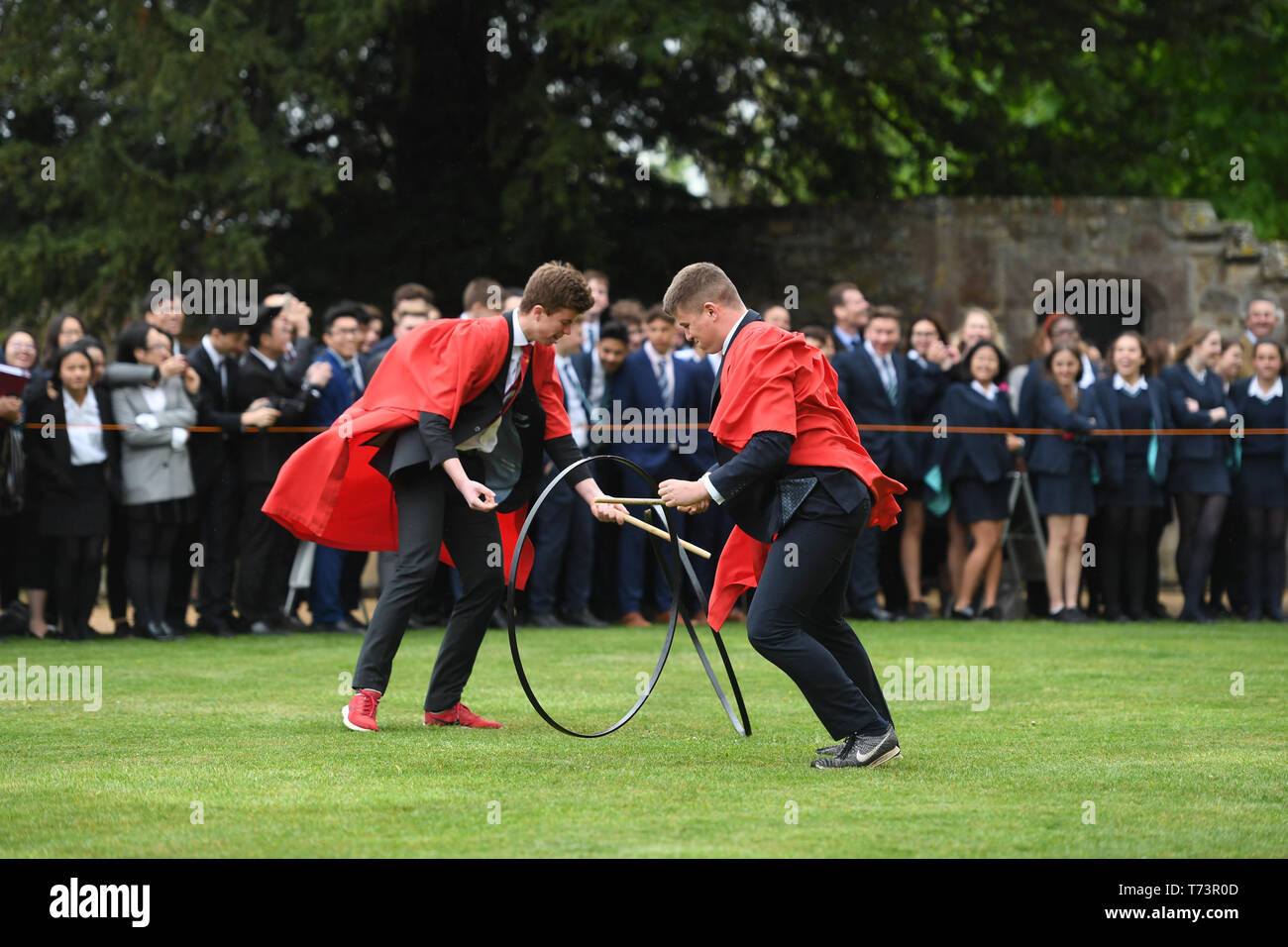 Pupils take part in the annual King's Ely Hoop Trundle on the east lawn ...