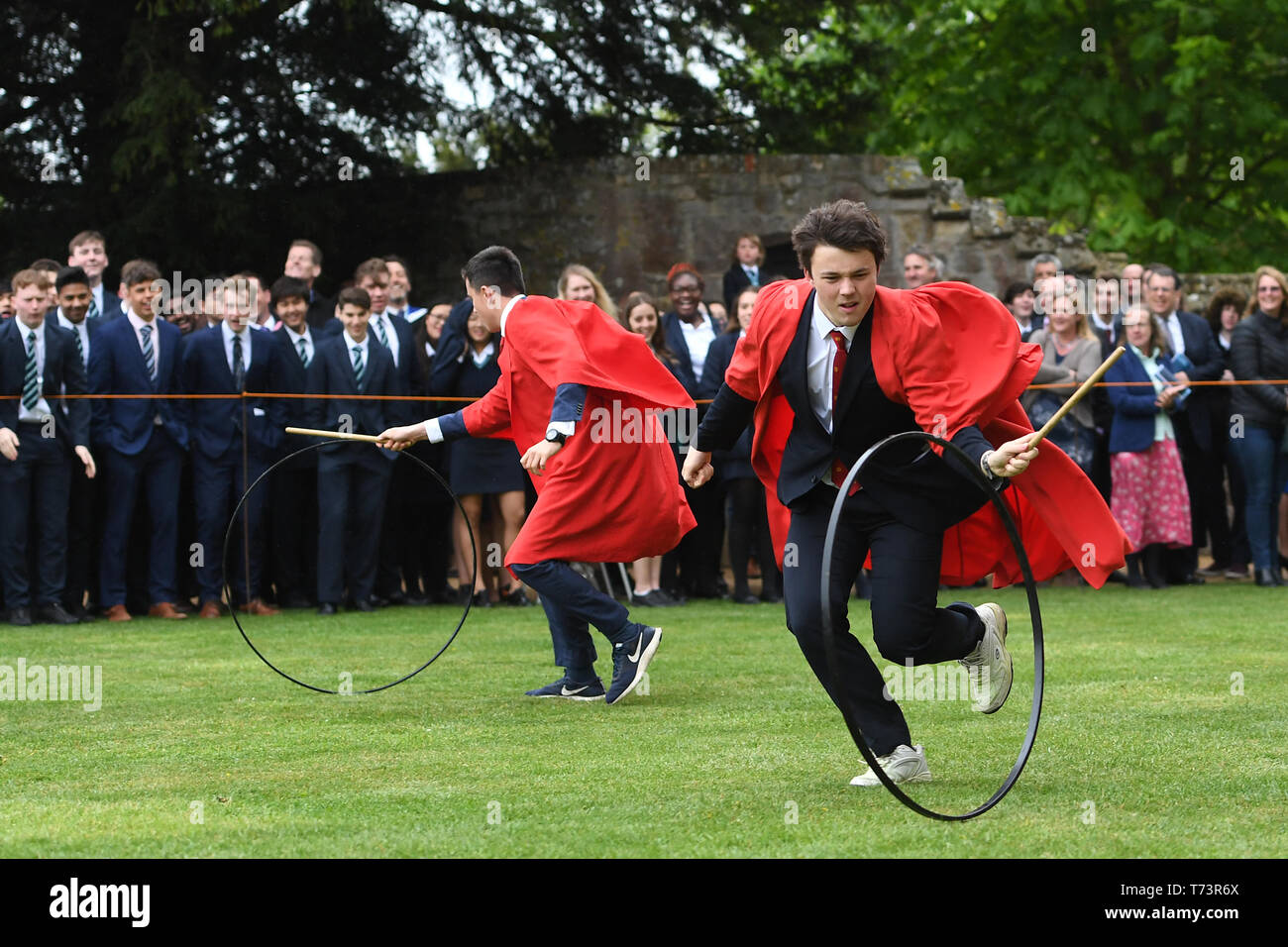 Pupils take part in the annual King's Ely Hoop Trundle on the east lawn ...