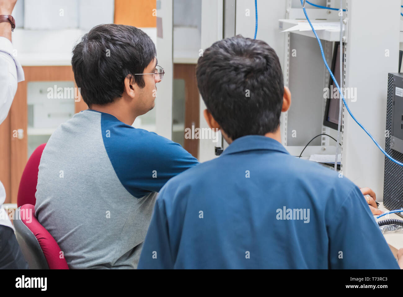 Group of Indian university computer engineering students working and ...