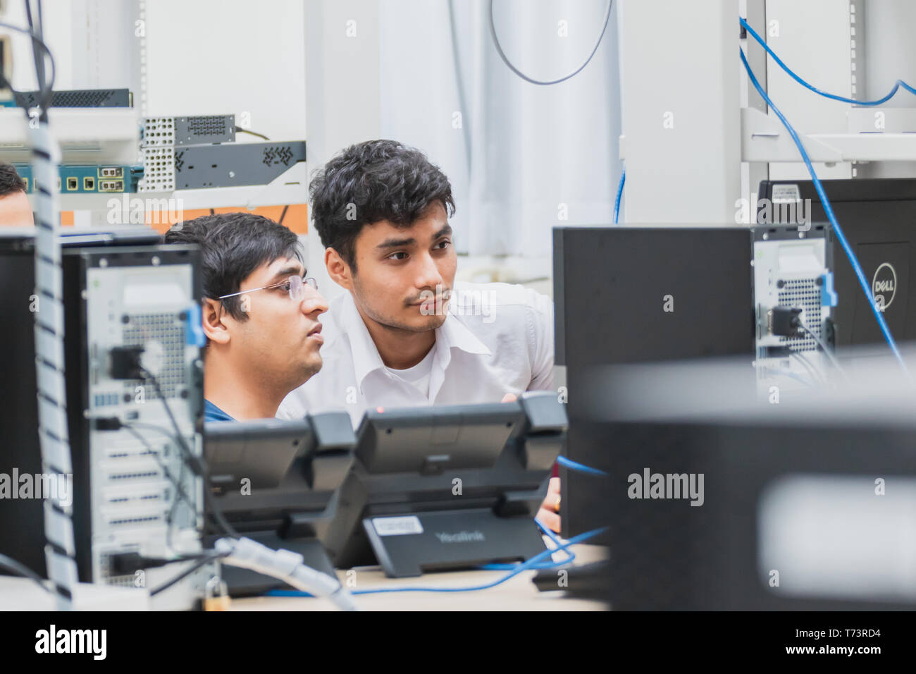 Group of Indian university computer engineering students working and ...