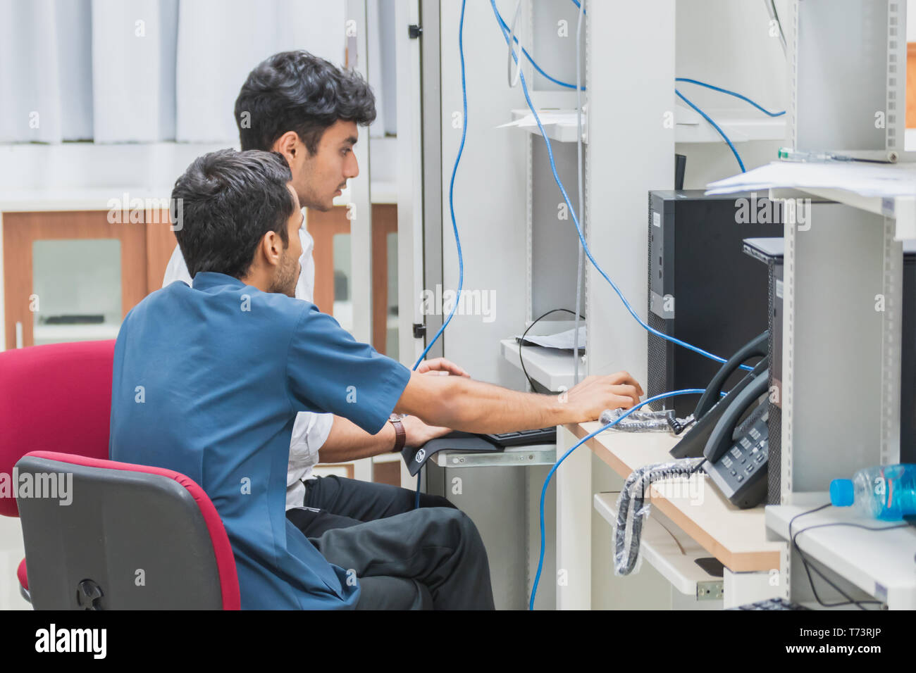 Group of Indian university computer engineering students working and ...