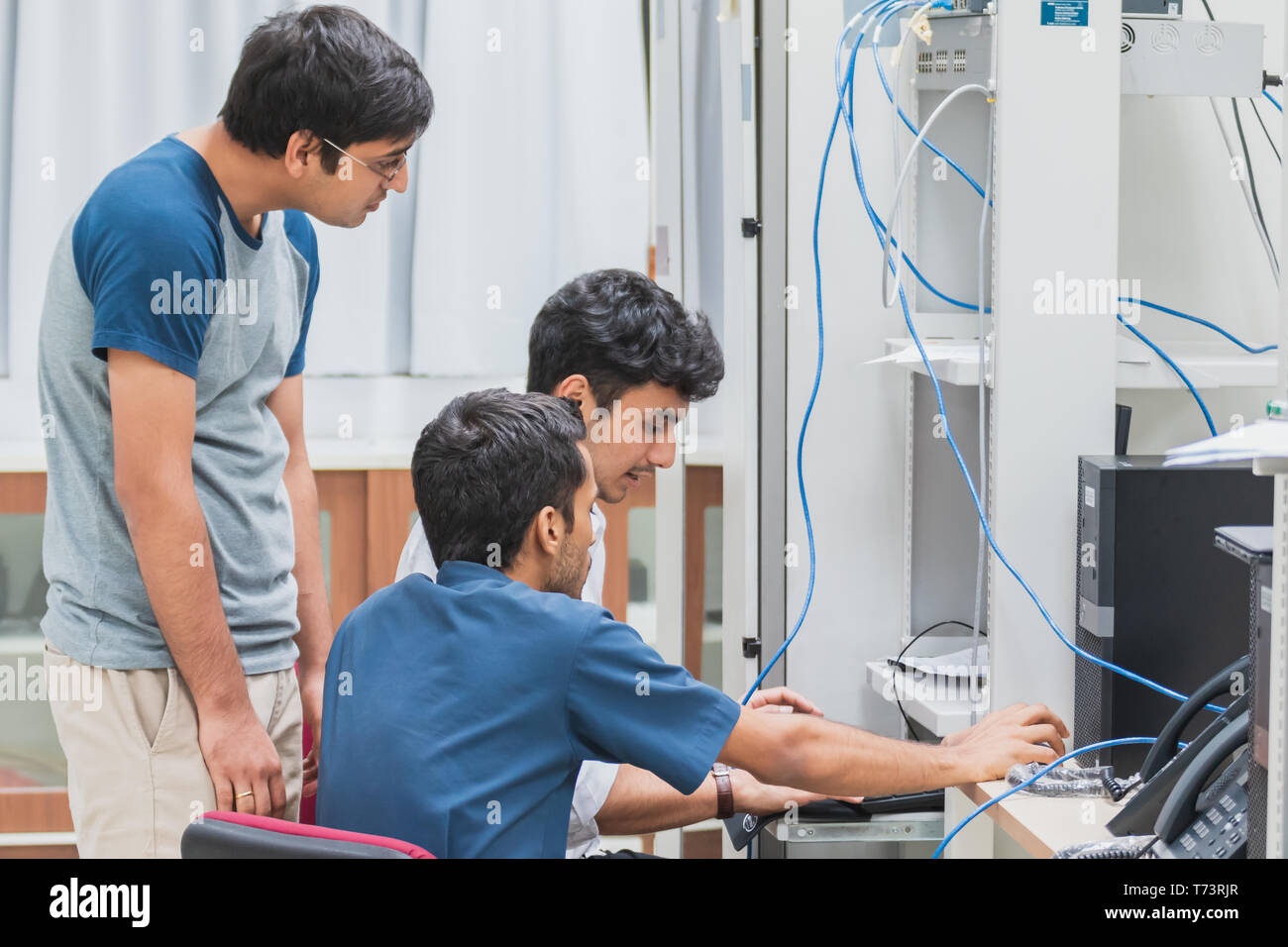 Group of Indian university computer engineering students working and ...