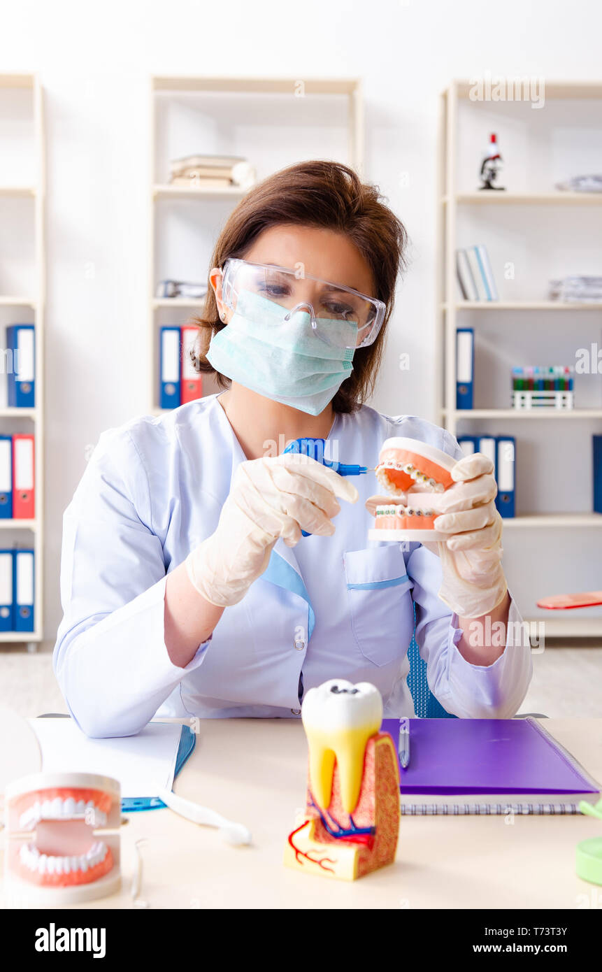 Female doctor working on new teeth implant Stock Photo - Alamy