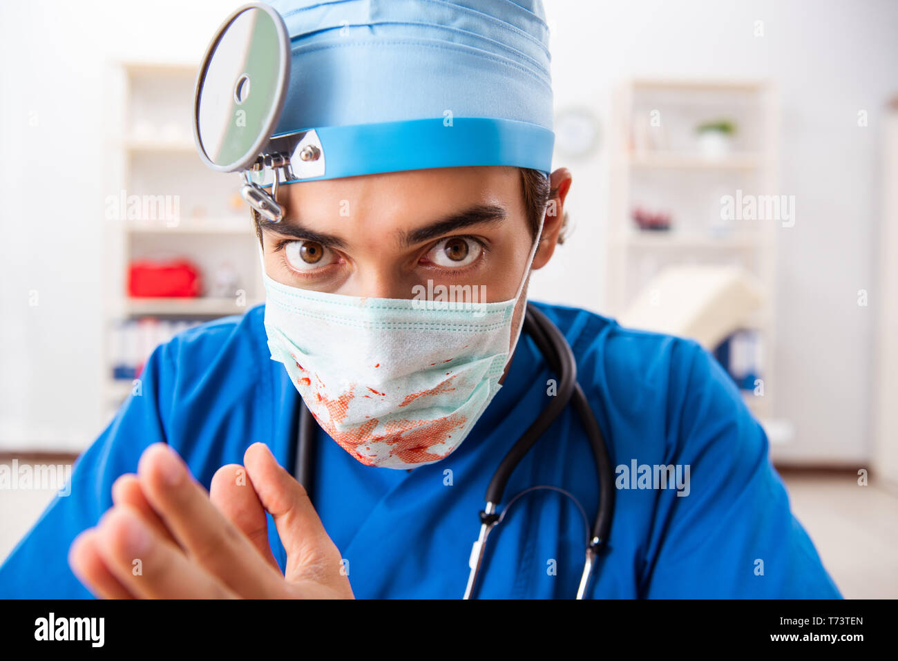 Mad doctor working in the clinic Stock Photo - Alamy