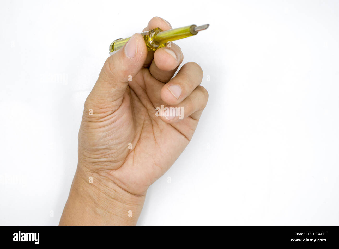 Male hand holding electric tester screwdriver to check the electrical ...