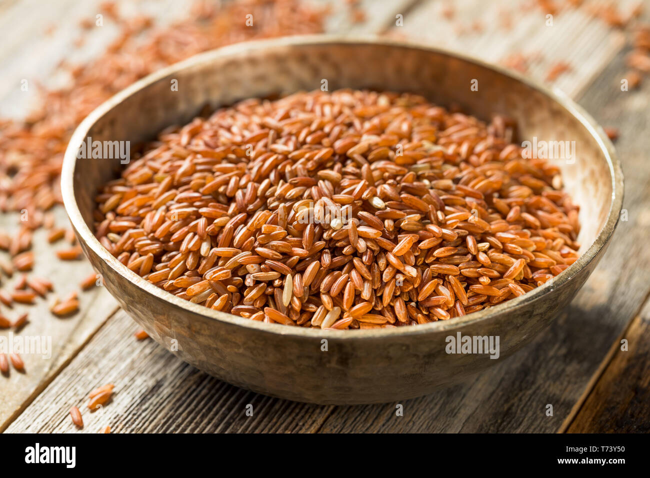 Dry Organic Red Rice in a Bowl Stock Photo - Alamy