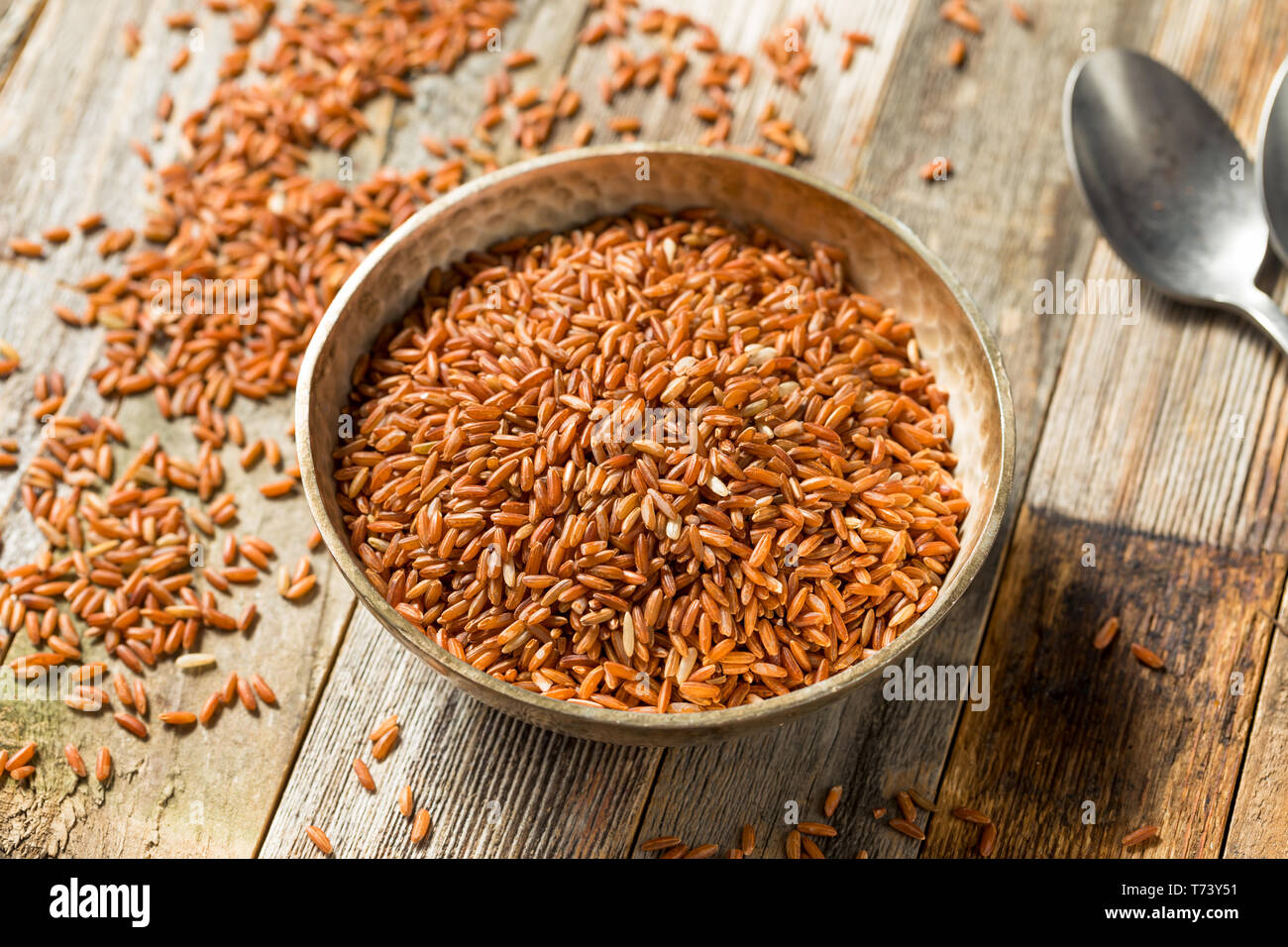 Dry Organic Red Rice in a Bowl Stock Photo - Alamy