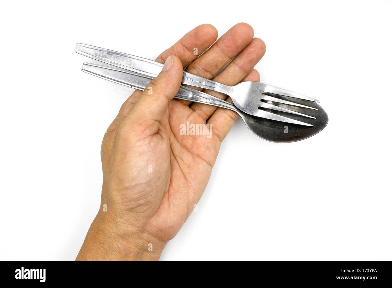 A male hand holding spoon and folk , man hand isolated on white ...