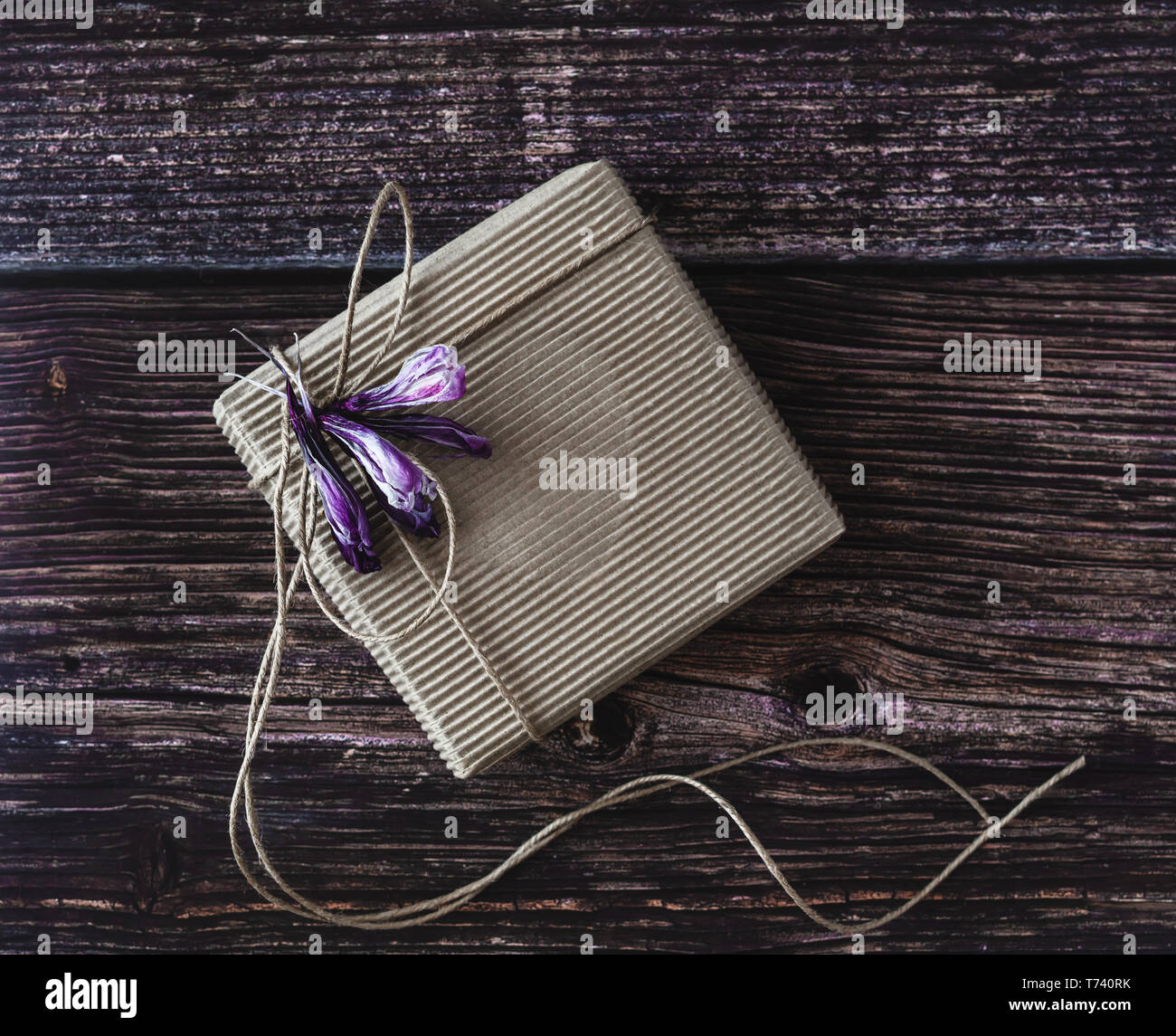 Handmade gift concept. Craft paper recycle gift box with flowers on ...