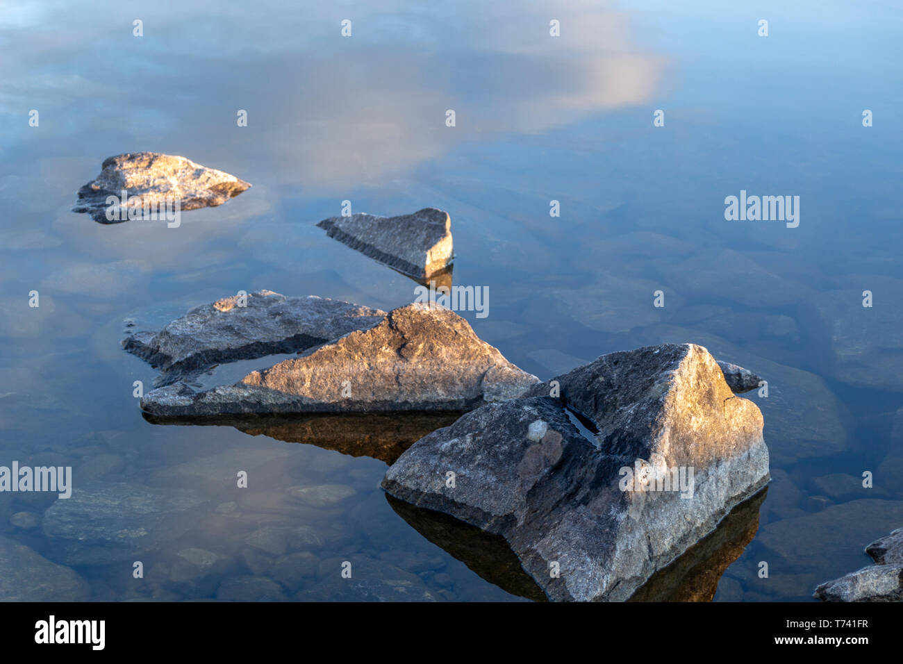 Reflection for natural grey stones for a corner Stock Photo - Alamy