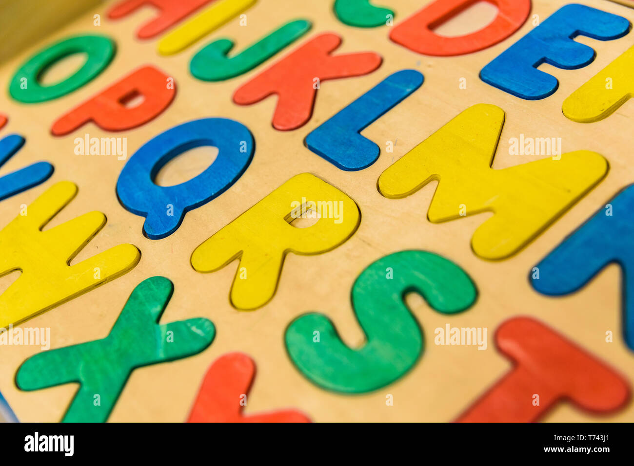 Alphabet with wooden letters in a children's classroom Stock Photo - Alamy