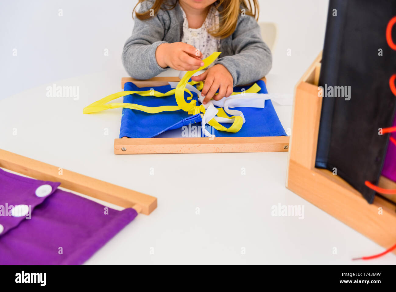 Tying his school tie hi-res stock photography and images - Alamy