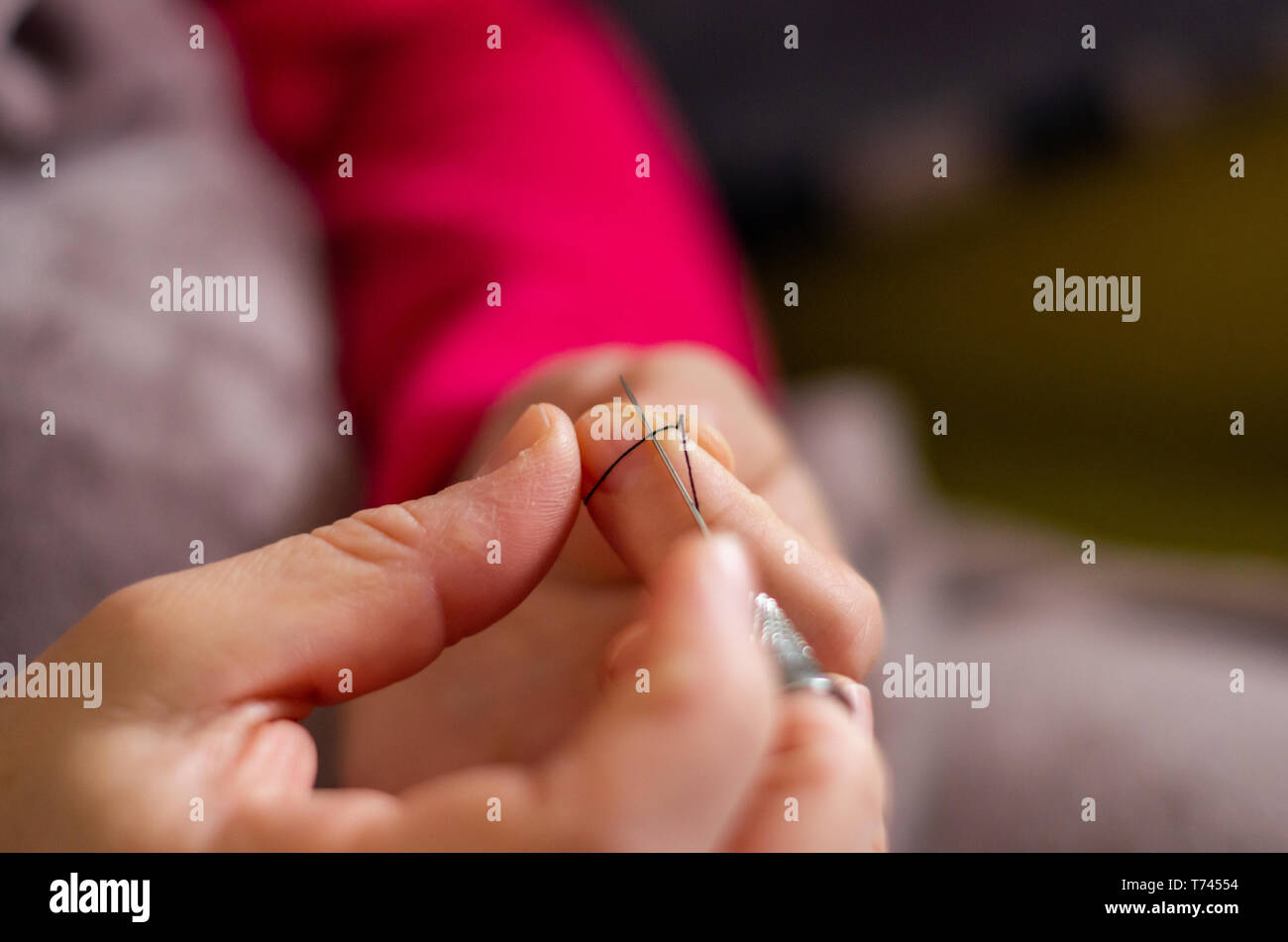Woman needle threading studio hi-res stock photography and images - Alamy