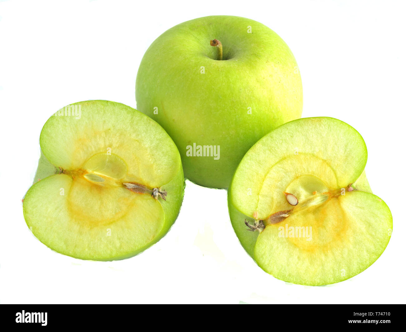 One whole and two half green apple isolated on white background Stock ...