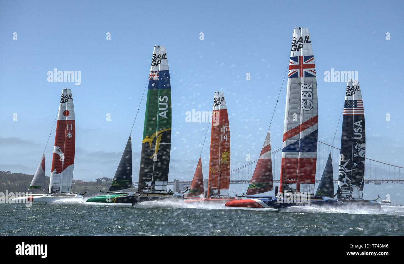 All six F50 catamarans in a line at the start of one of the fleet ...