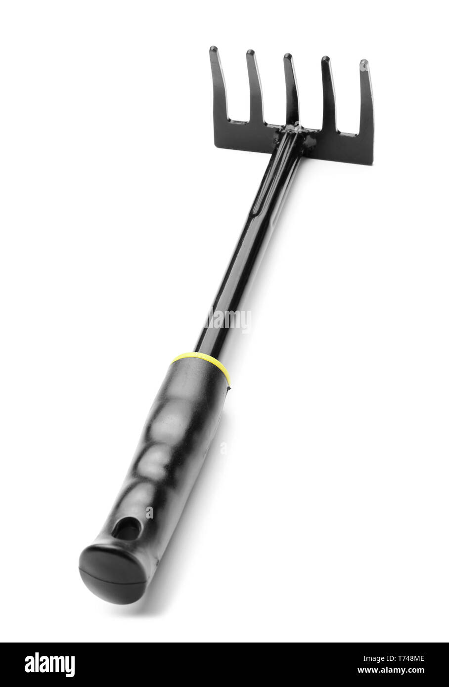 Metal rake for gardening on white background Stock Photo - Alamy