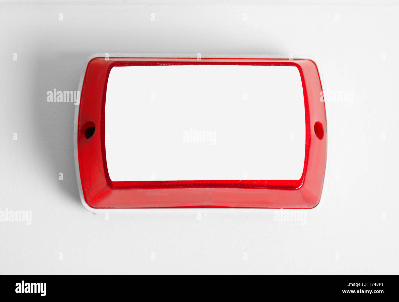 Modern alarm lamp on wall indoors Stock Photo - Alamy