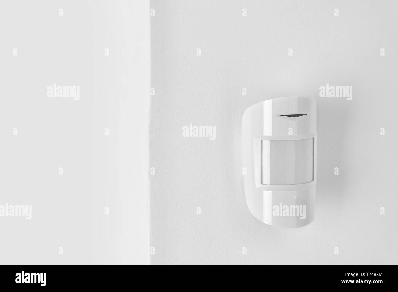 Modern motion sensor indoors Stock Photo - Alamy