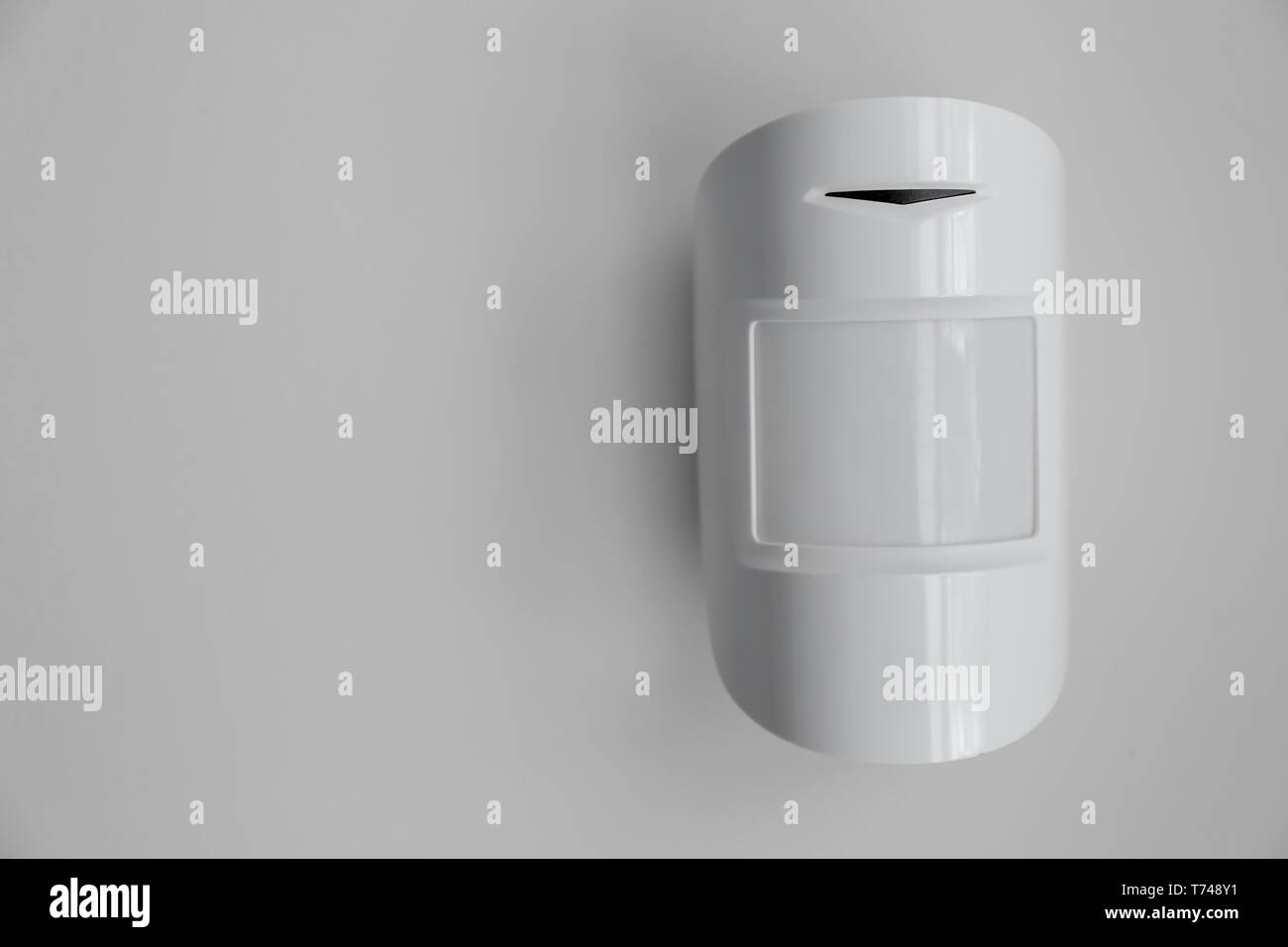 Modern motion sensor indoors Stock Photo - Alamy