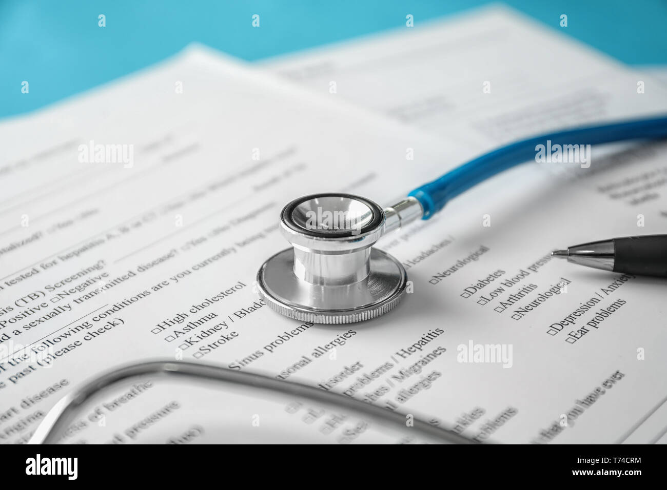Stethoscope and patient medical history, closeup. Health care concept ...