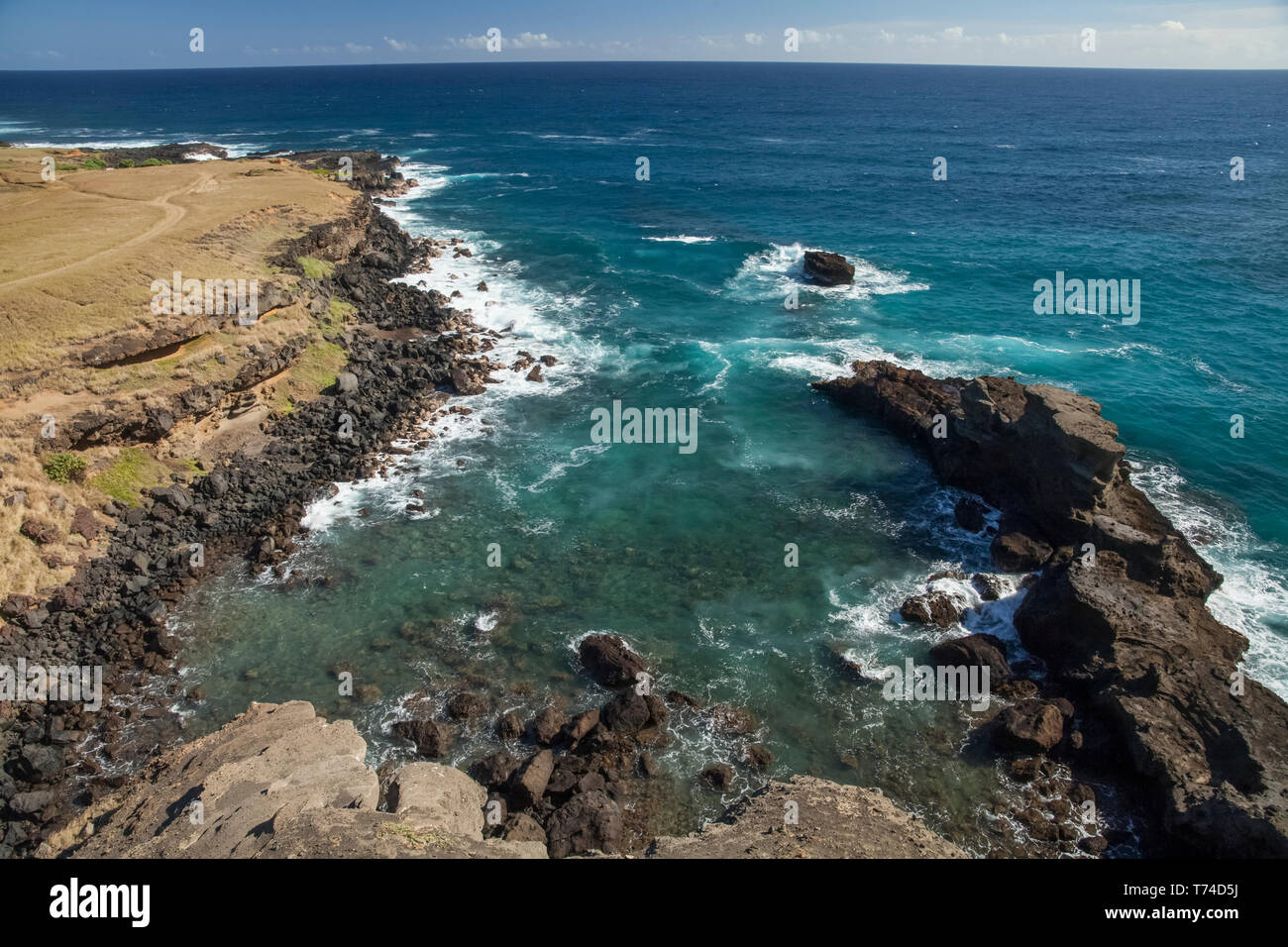 Rocky shoreline near Papakolea beach, also known as Green Sand Beach ...