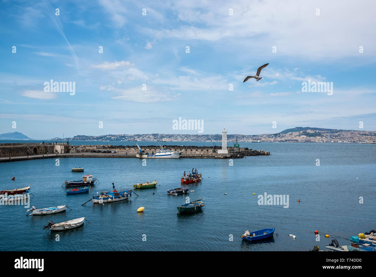 Boats in a small port overlooking Naples in the Gulf of Naples; Naples ...