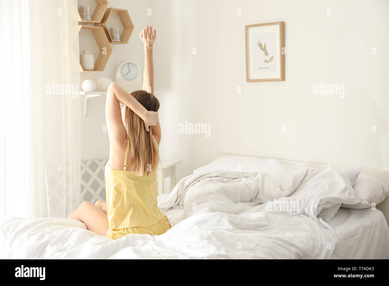 Morning of beautiful young woman in bedroom Stock Photo - Alamy