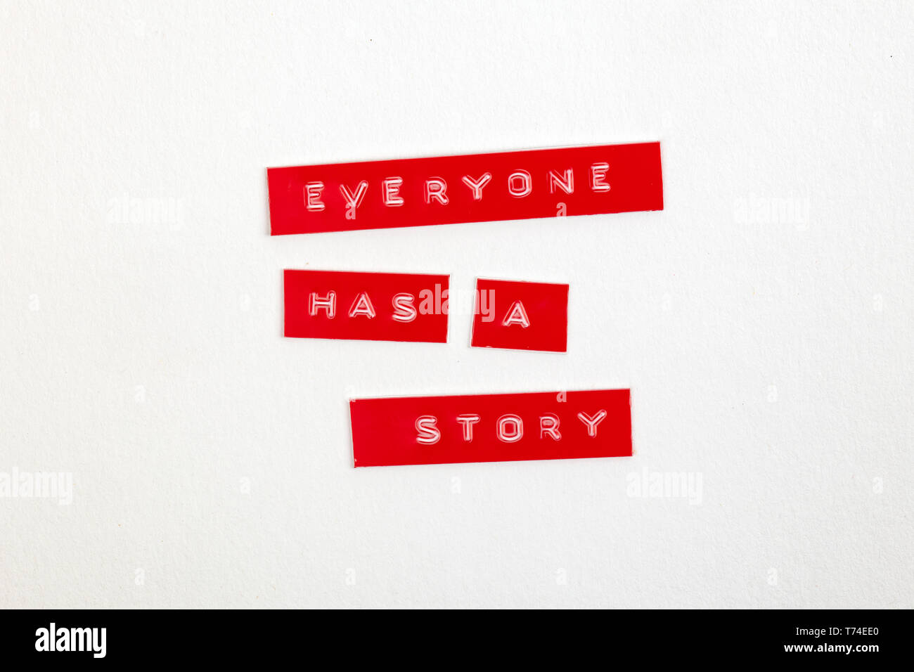 Concept Everyone has a story with a label printer on white bckground ...