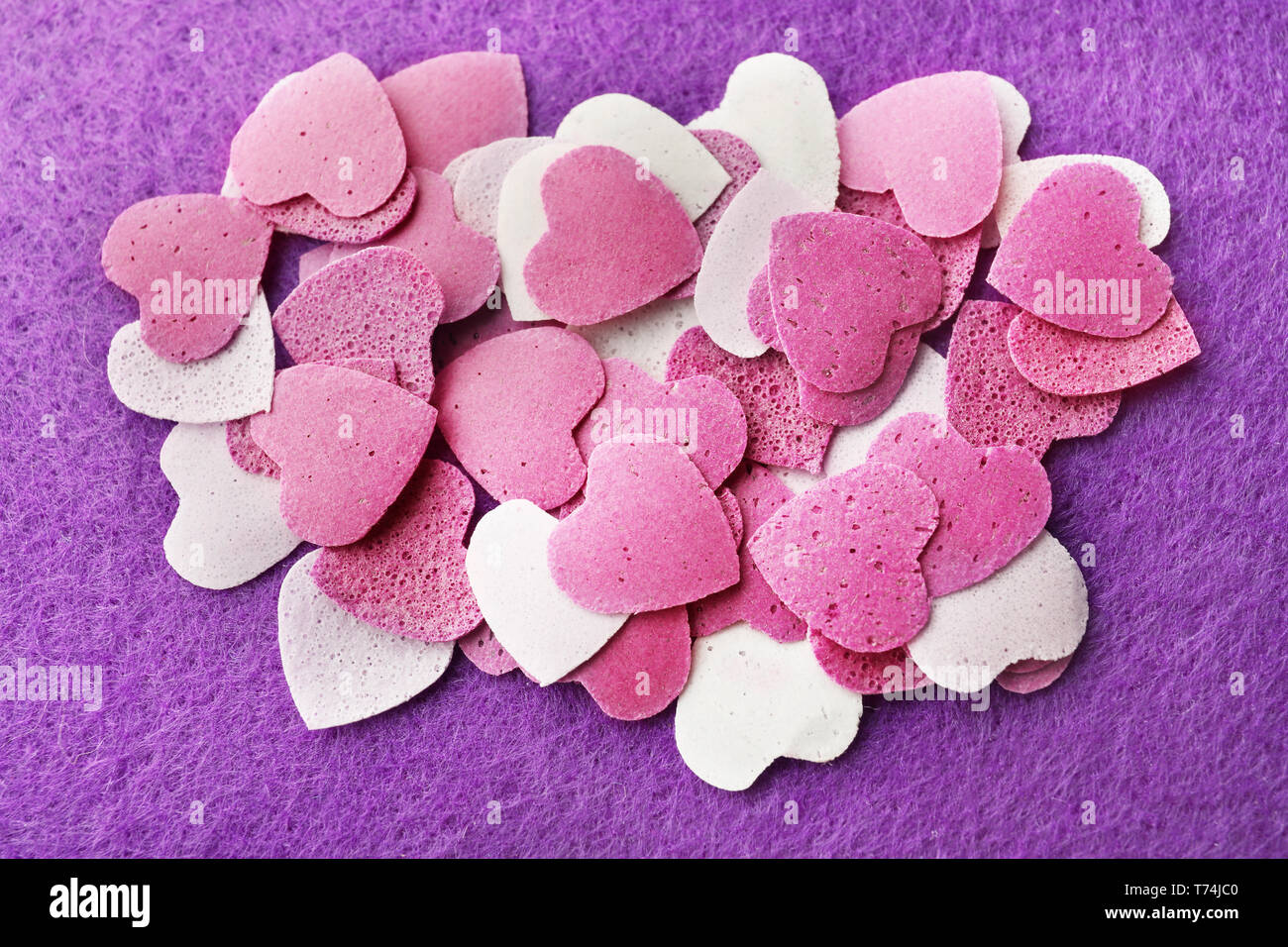 Many hearts on purple background Stock Photo - Alamy