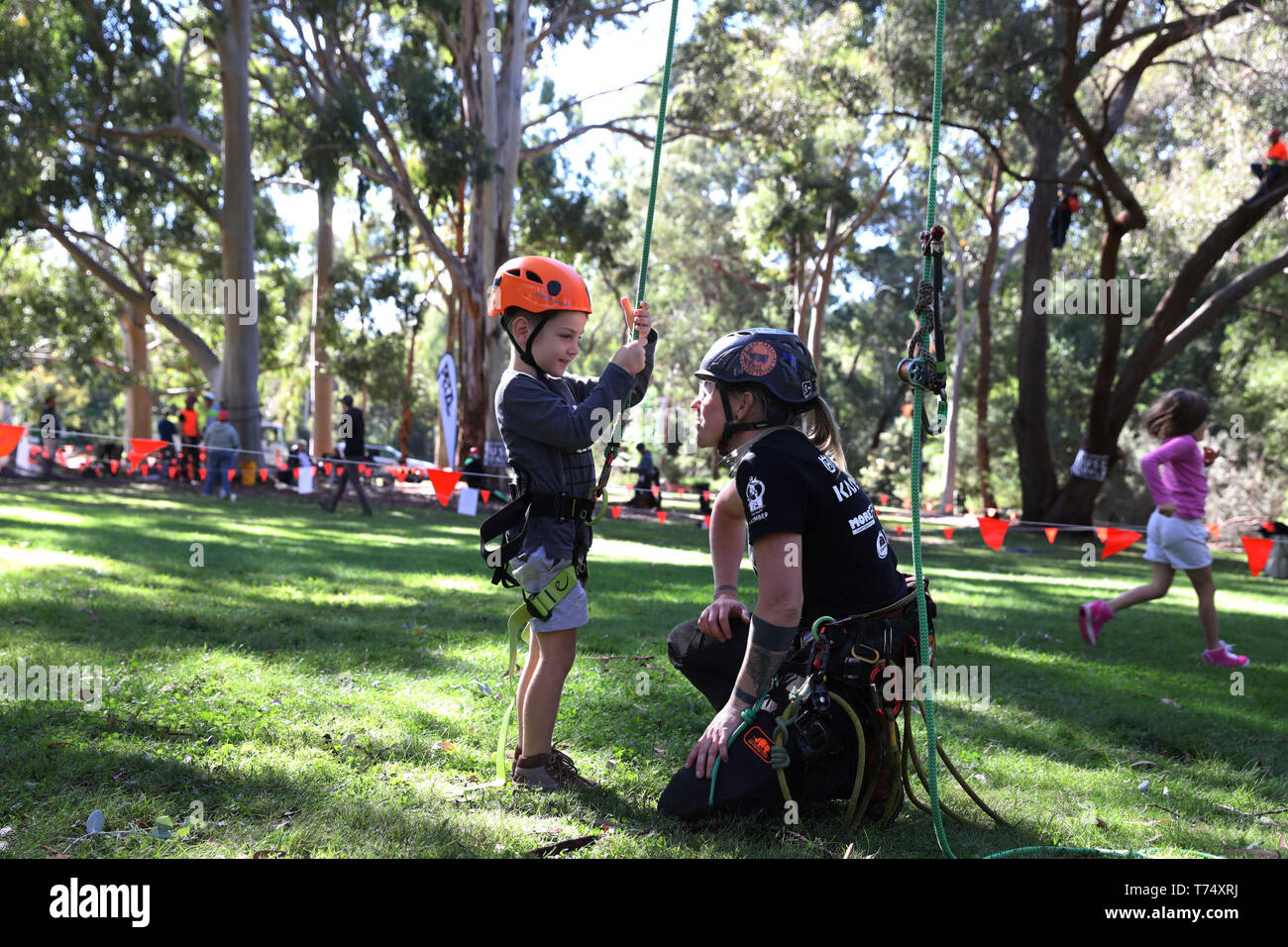 Canberra, Australia. 4th May, 2019. A coach teaches skills to a child ...