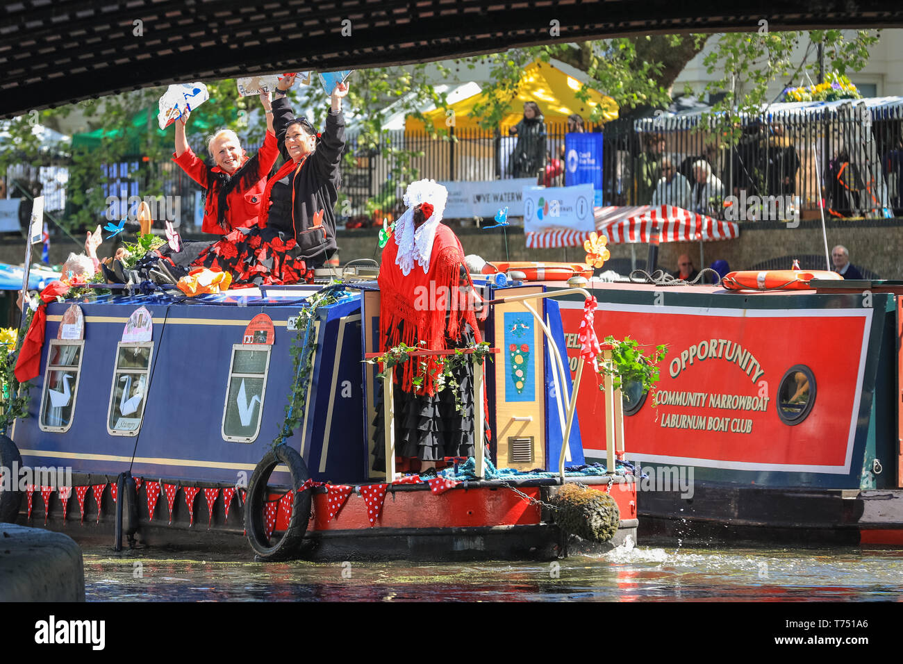 London, UK, 4th May 2019. A boat crew dressed in Victorian outfits wave ...