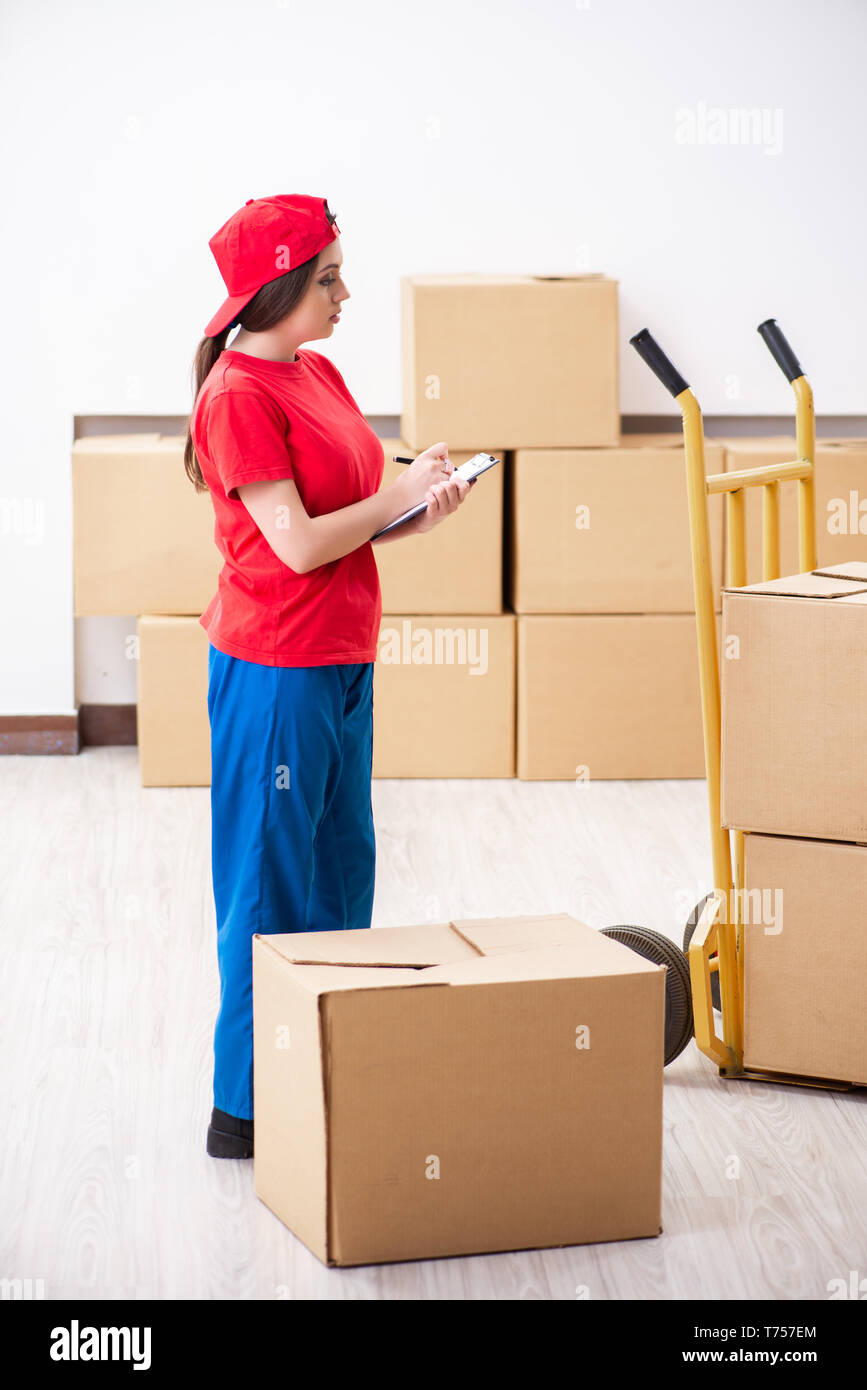 Young female professional mover doing home relocation Stock Photo - Alamy