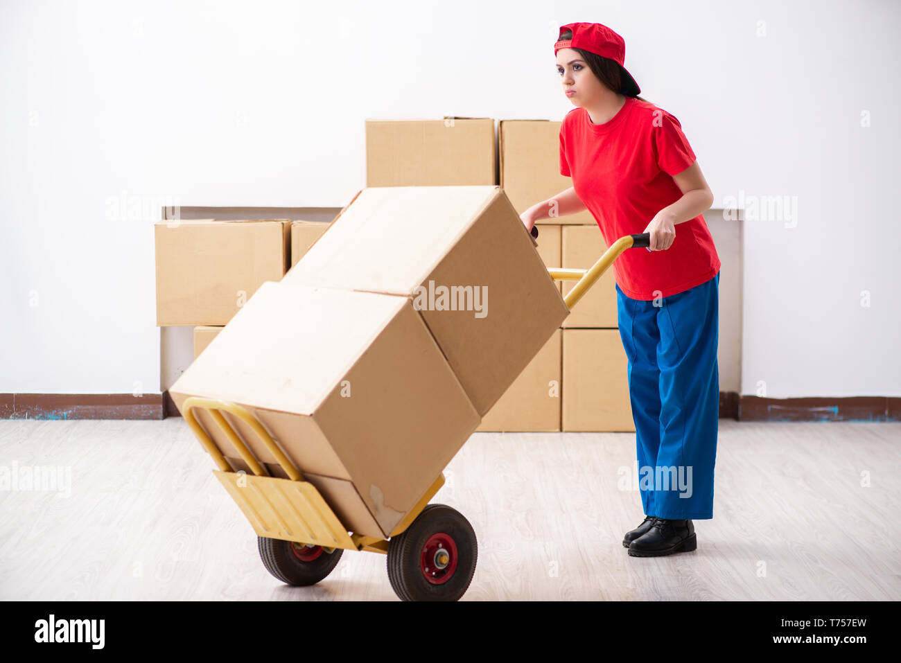 Young female professional mover doing home relocation Stock Photo - Alamy