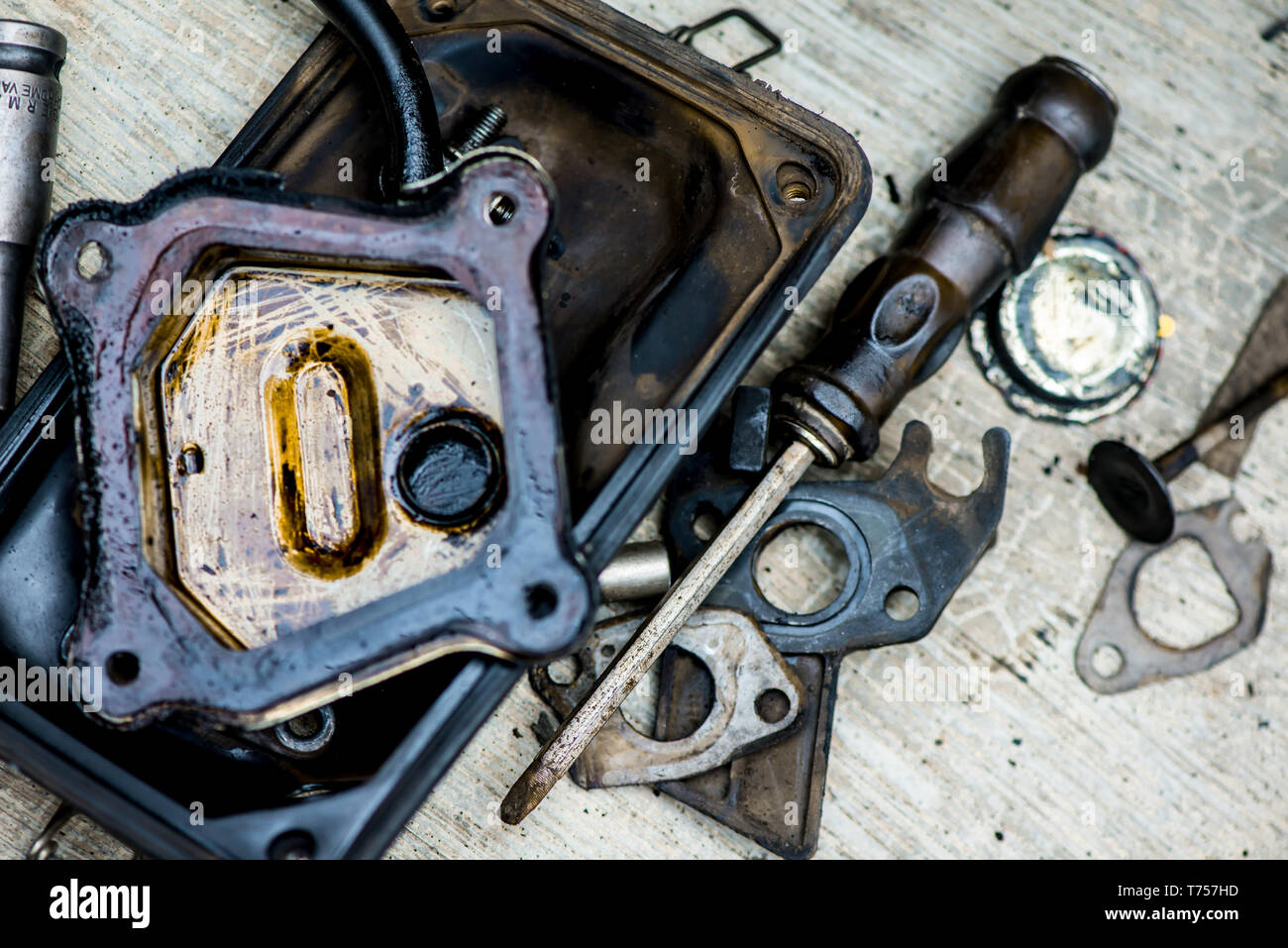 Black Hands working on different machine parts Stock Photo - Alamy