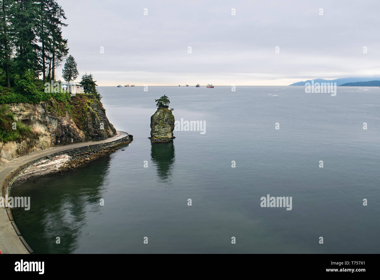 Siwash Rock is an iconic symbol of Stanley Park in downtown Vancouver ...