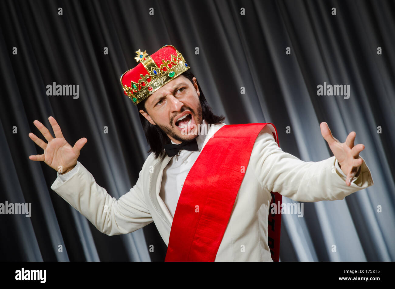 Funny king wearing crown in coronation concept Stock Photo - Alamy