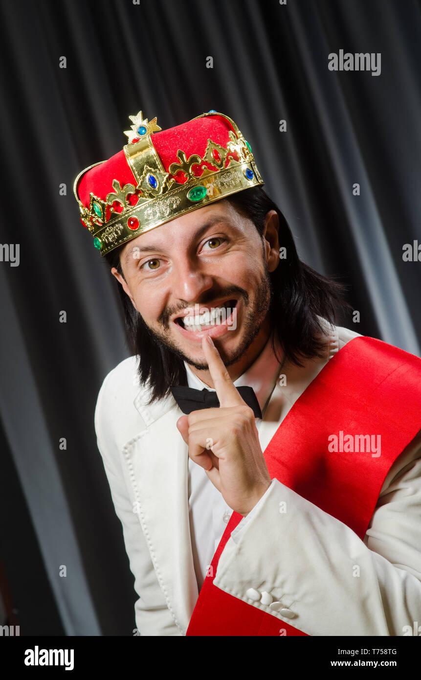 Funny king wearing crown in coronation concept Stock Photo - Alamy
