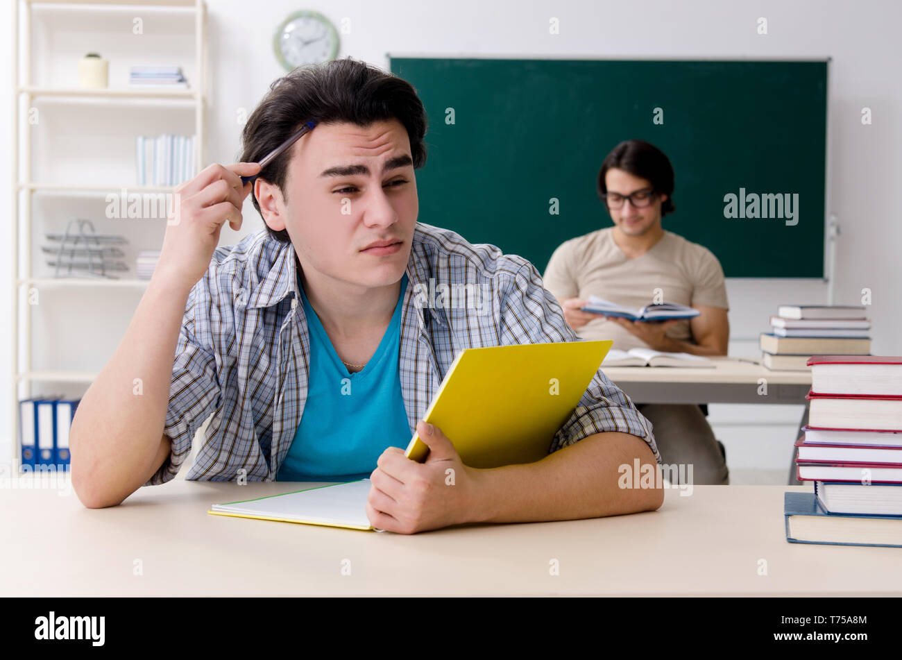 Two male students in the classroom Stock Photo - Alamy